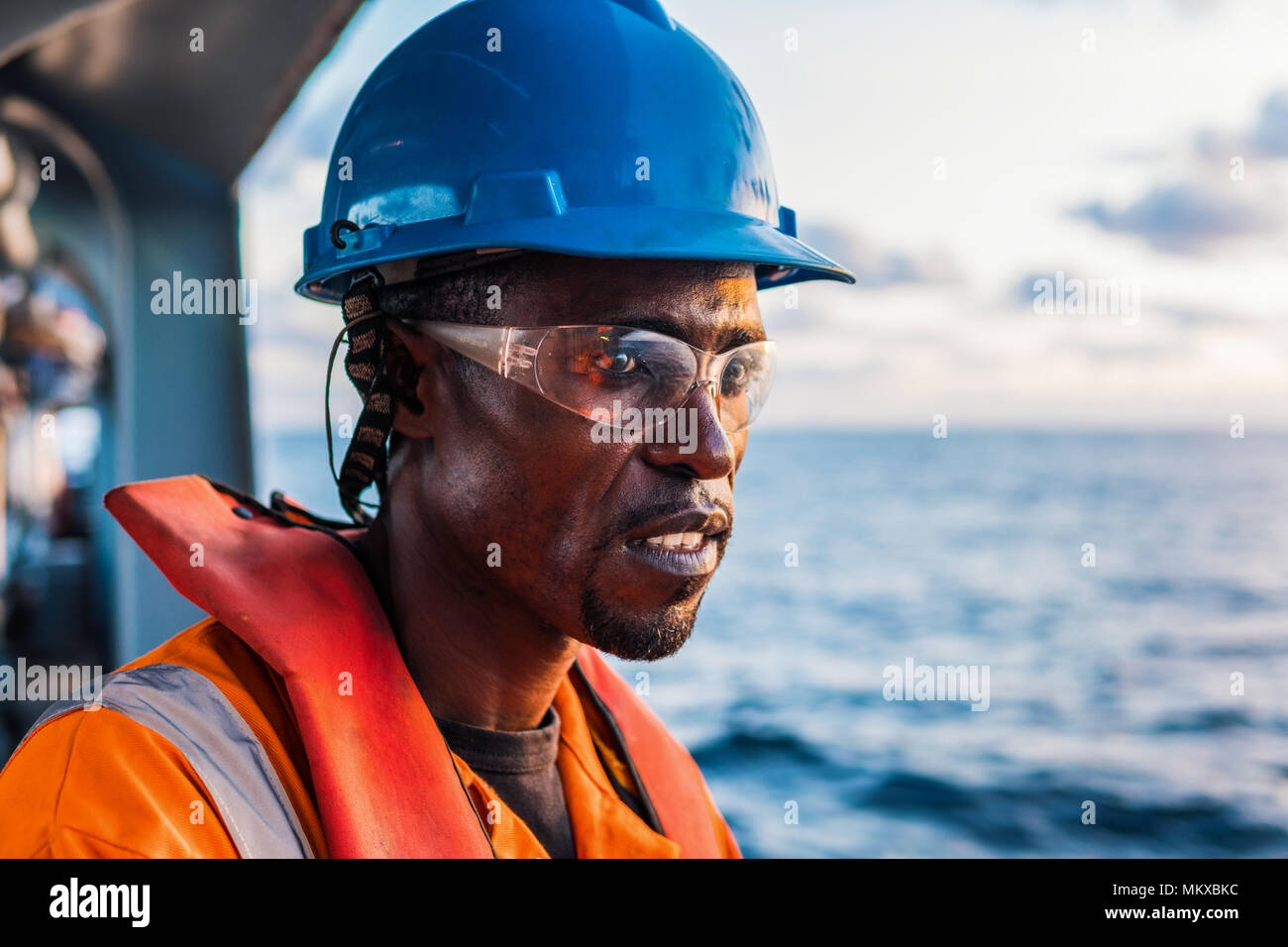 Seaman AB or Bosun on deck of vessel or ship , wearing PPE Stock Photo ...