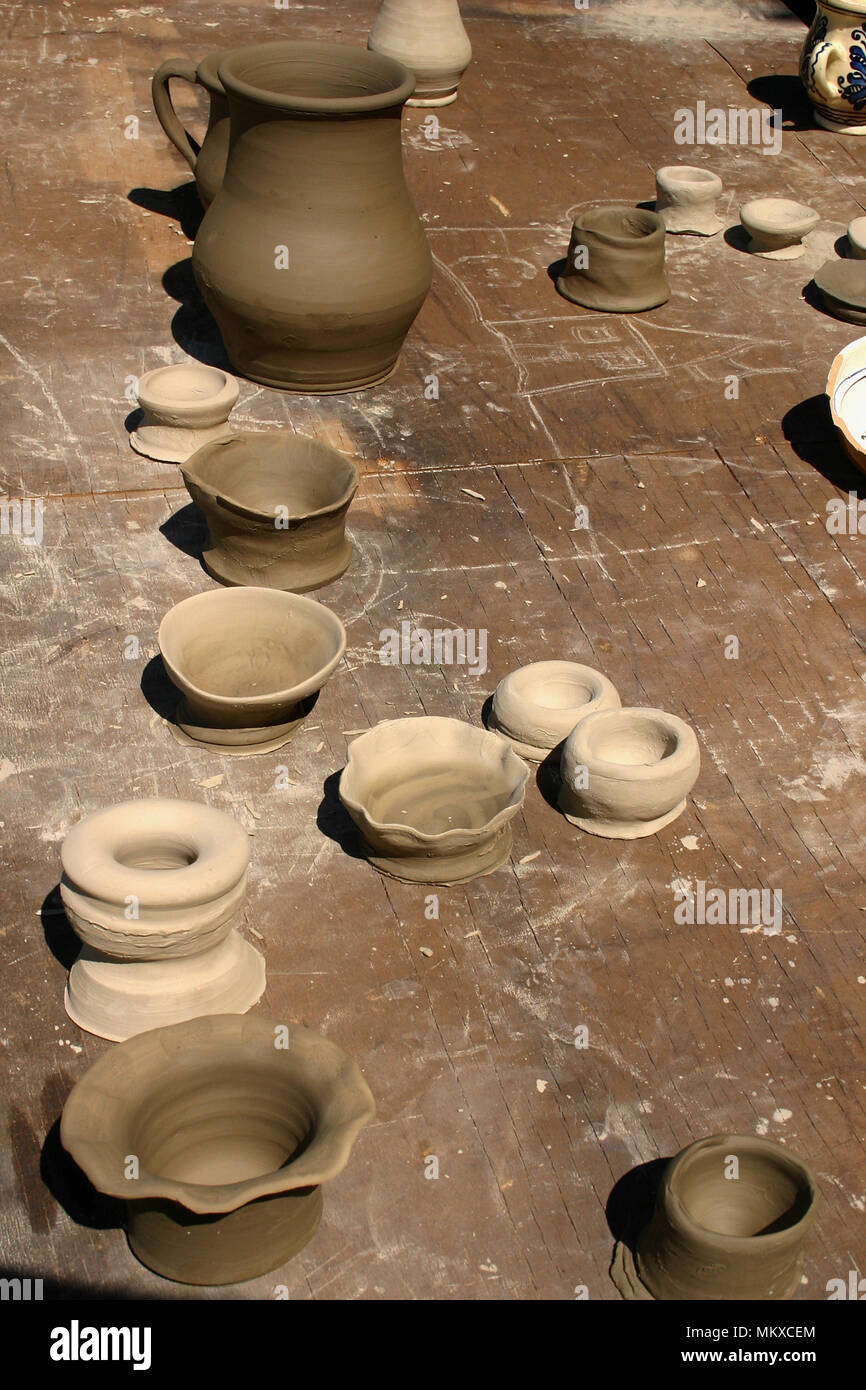 Clay molded into different shapes, drying in the sun Stock Photo - Alamy