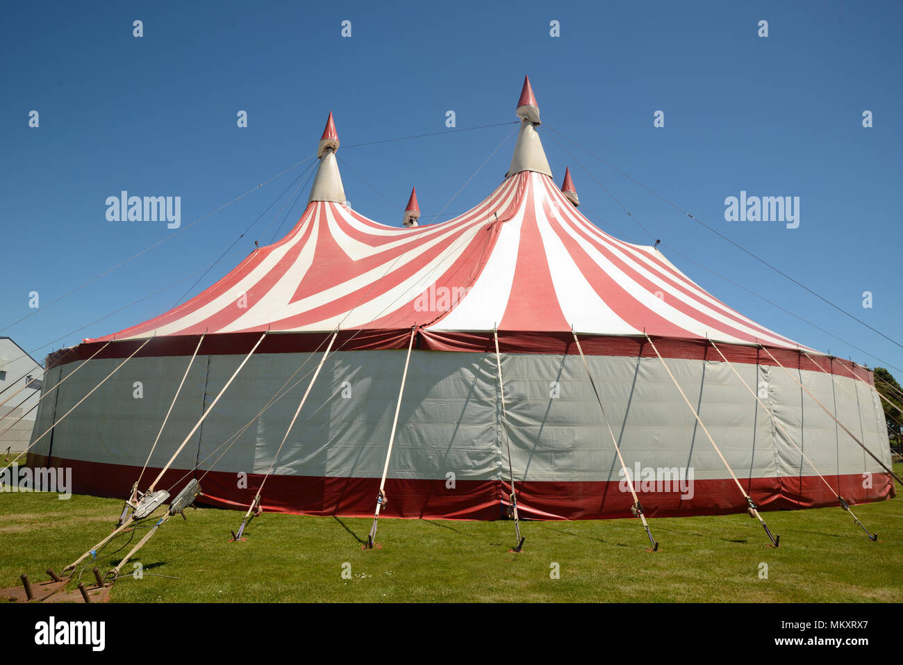 Colourful circus tent against a blue sky Stock Photo - Alamy