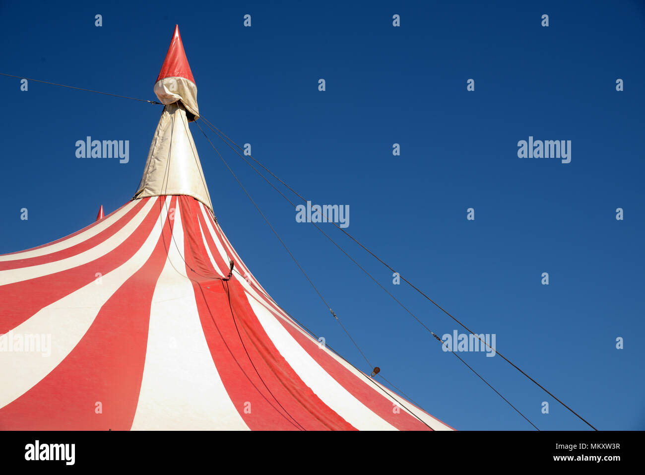 Colourful circus tent against a blue sky Stock Photo - Alamy
