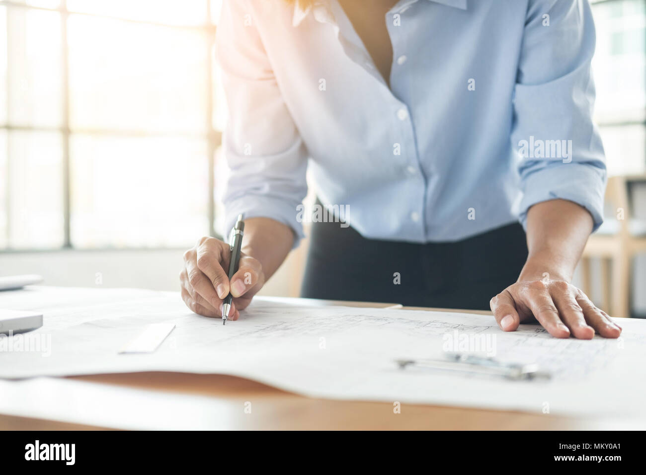 Person's engineer Hand Drawing Plan On Blue Print with architect ...