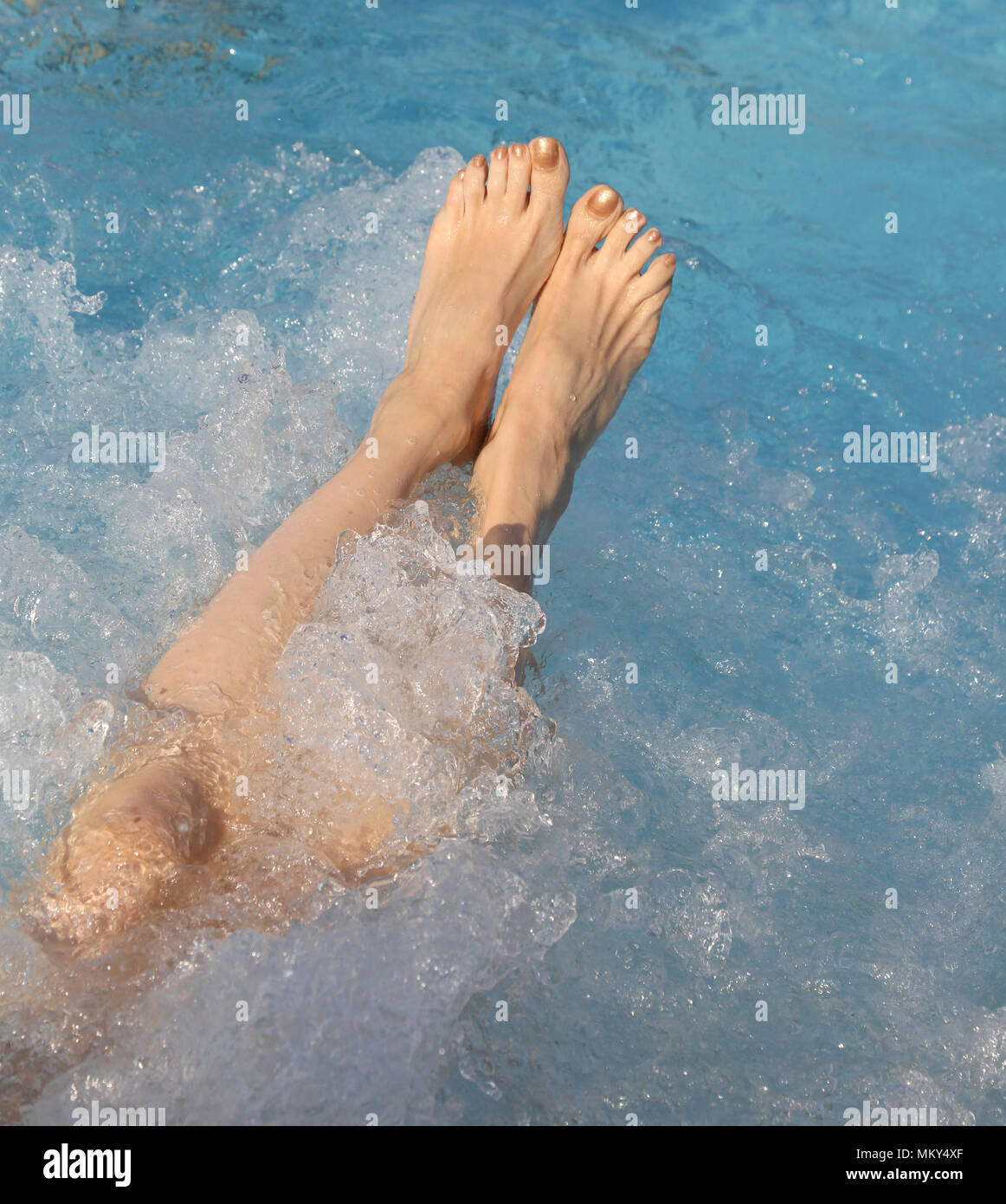 young woman's feet during the whirlpool therapy in the spa pool Stock ...
