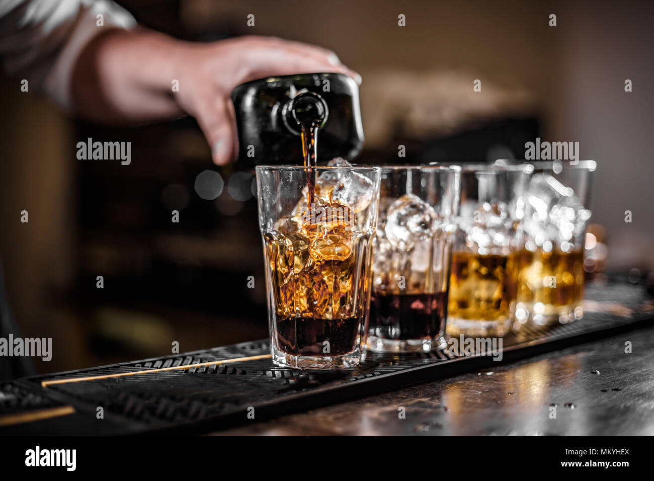 Pouring whisky into glass hi-res stock photography and images - Alamy