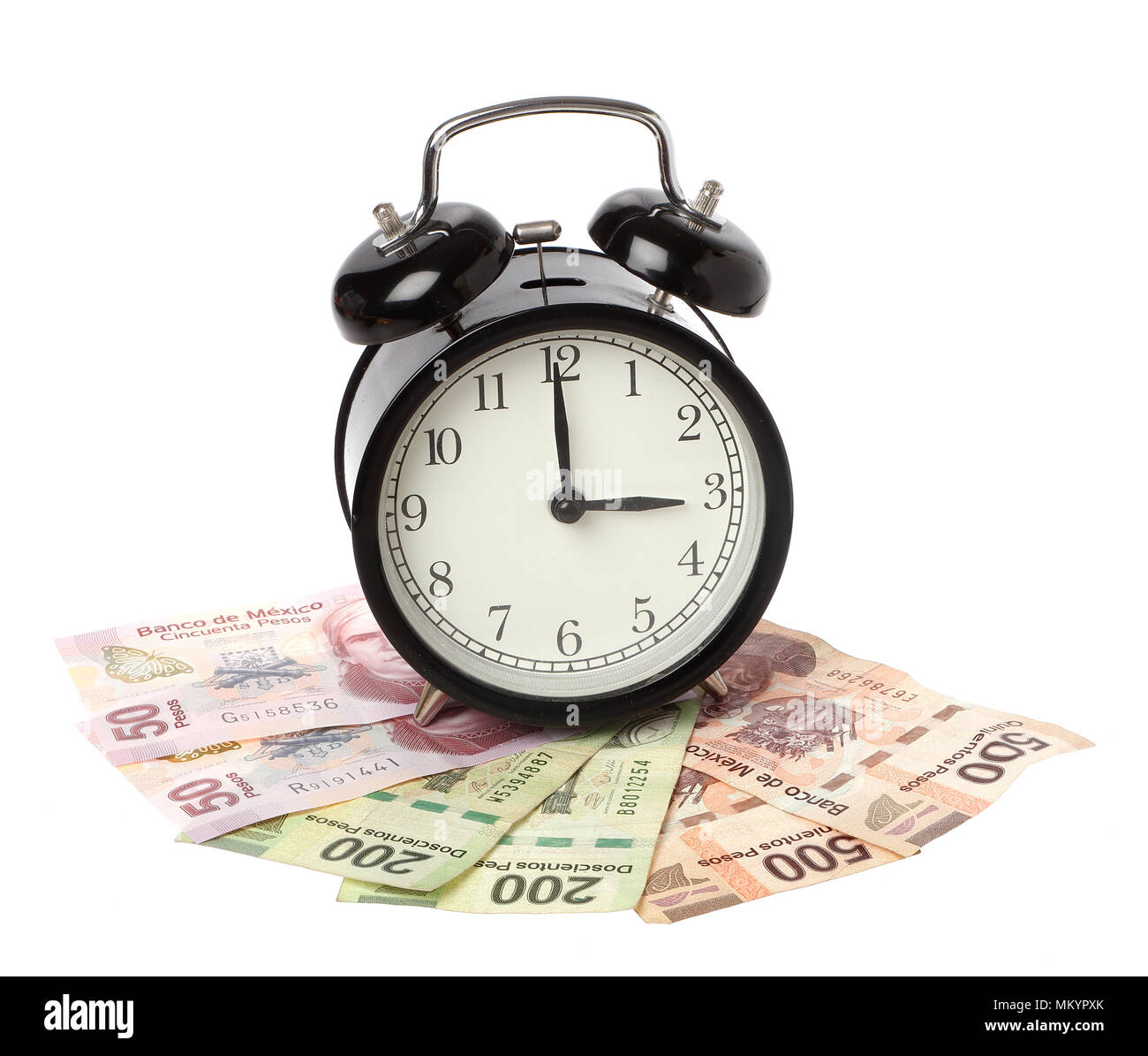 One black alaram clock on Mexican Pesos banknotes isolated on white ...