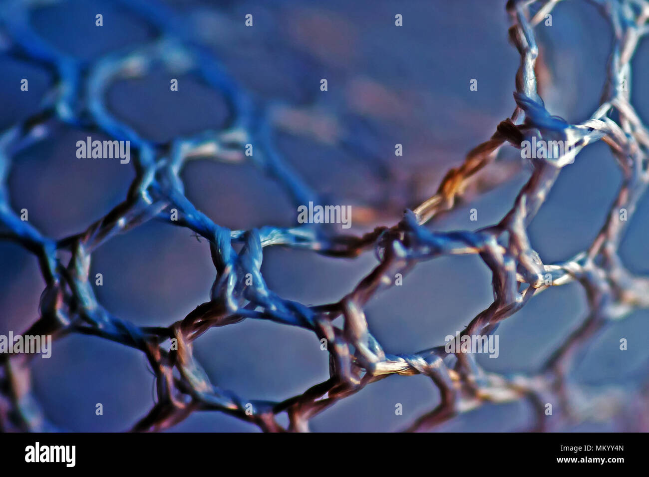 Complex geometric patterns and structures formed by an everyday net bag ...