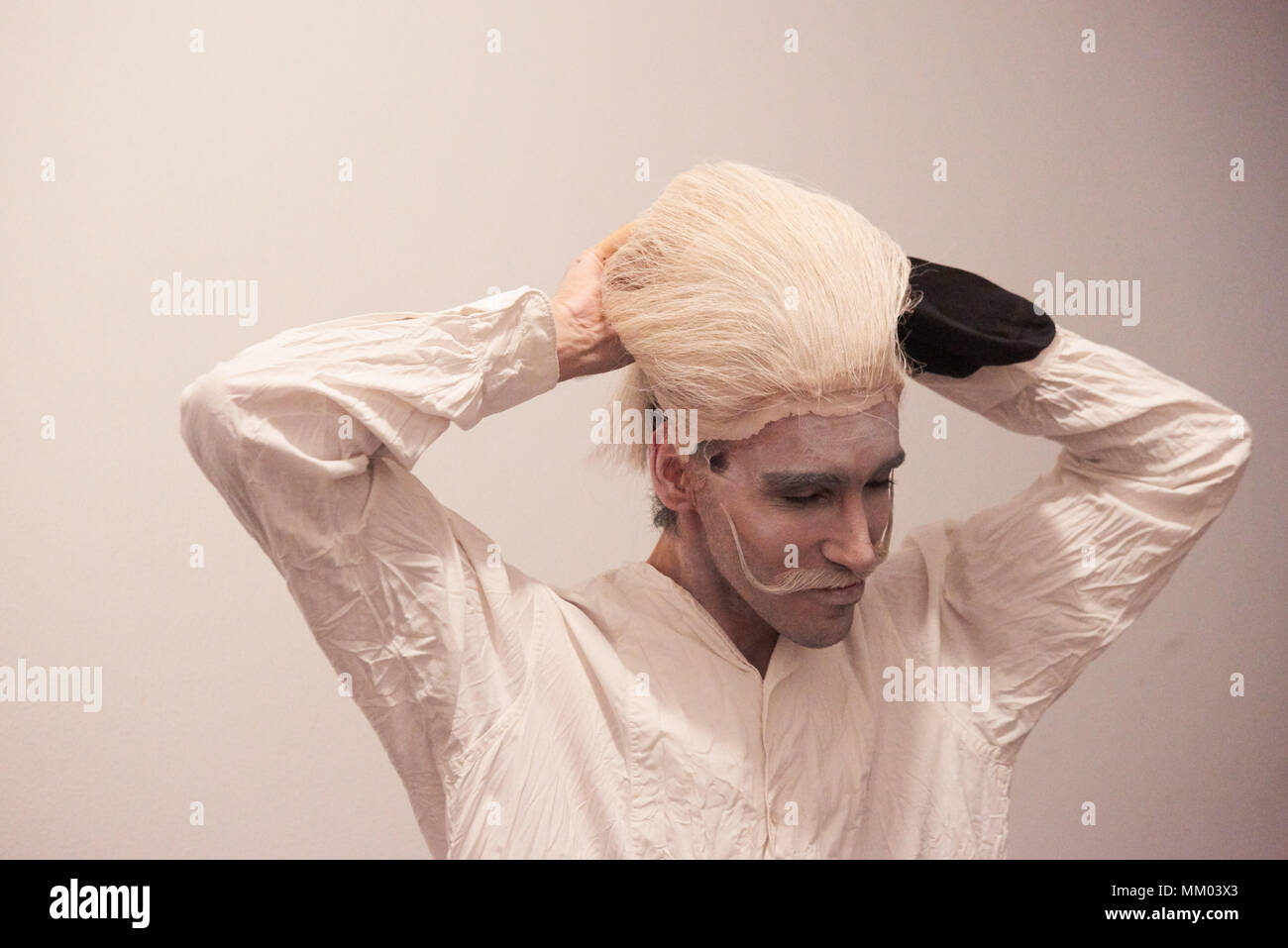 Taking off wig hi-res stock photography and images - Alamy
