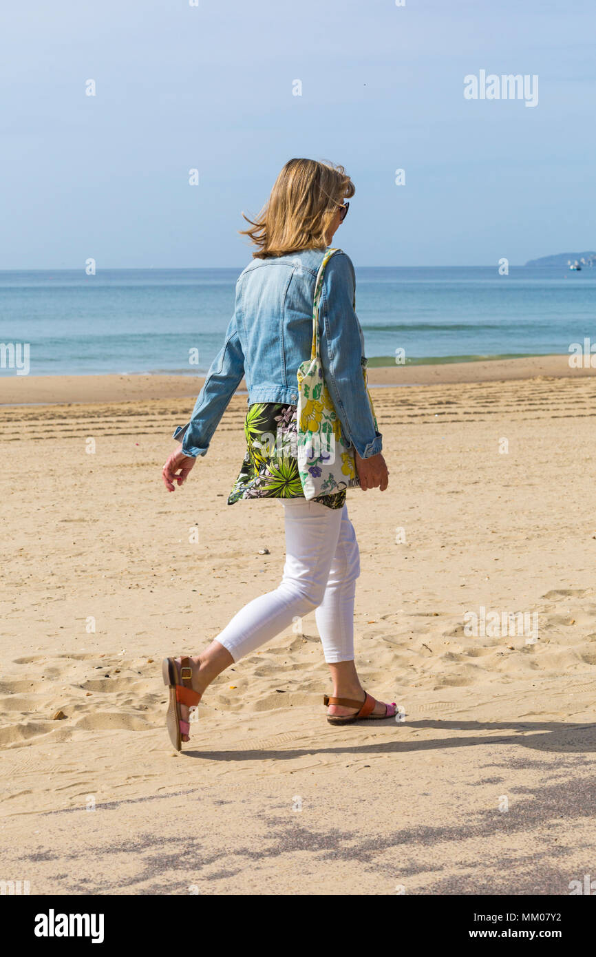 Woman strolling along bournemouth seafront hi-res stock photography and ...