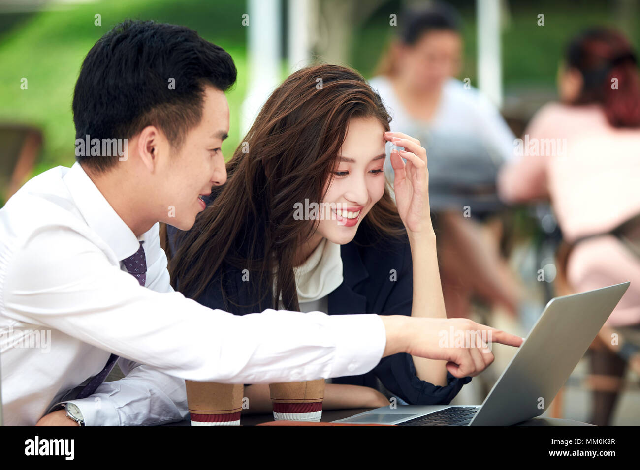 Business people use computers in the outdoor Stock Photo - Alamy