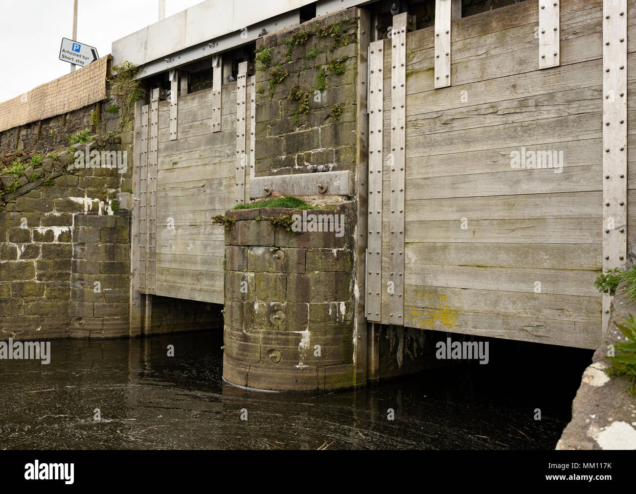 Sluice gates, flood defences, Pwllheli north wales uk Stock Photo - Alamy