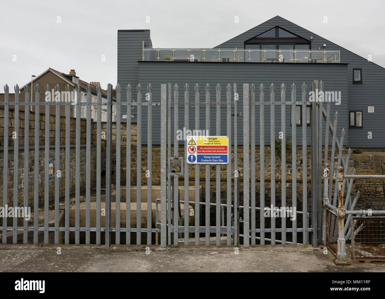 danger confined area risk warning sign sign bilingual welsh and english ...