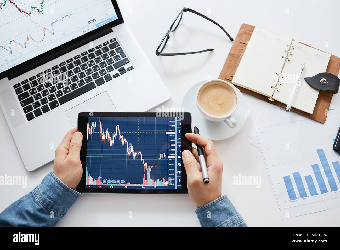 Investor watching the change of stock market on tablet Stock Photo - Alamy