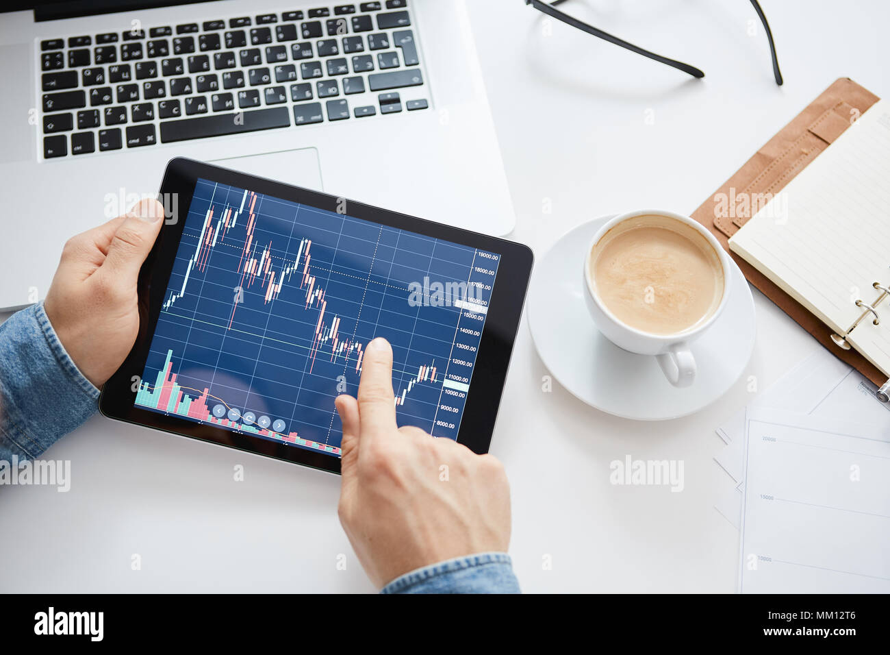 Investor watching the change of stock market on tablet Stock Photo - Alamy