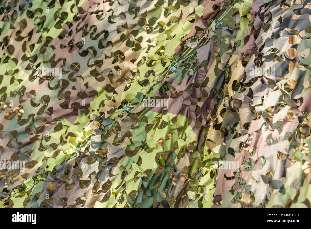 Camouflage mesh hidden military objects, (camouflage Stock Photo - Alamy