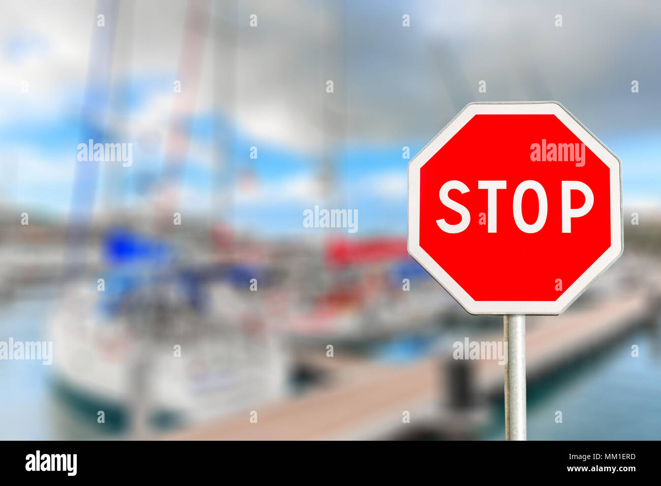 Red Stop sign on sailboat blurred background Stock Photo - Alamy