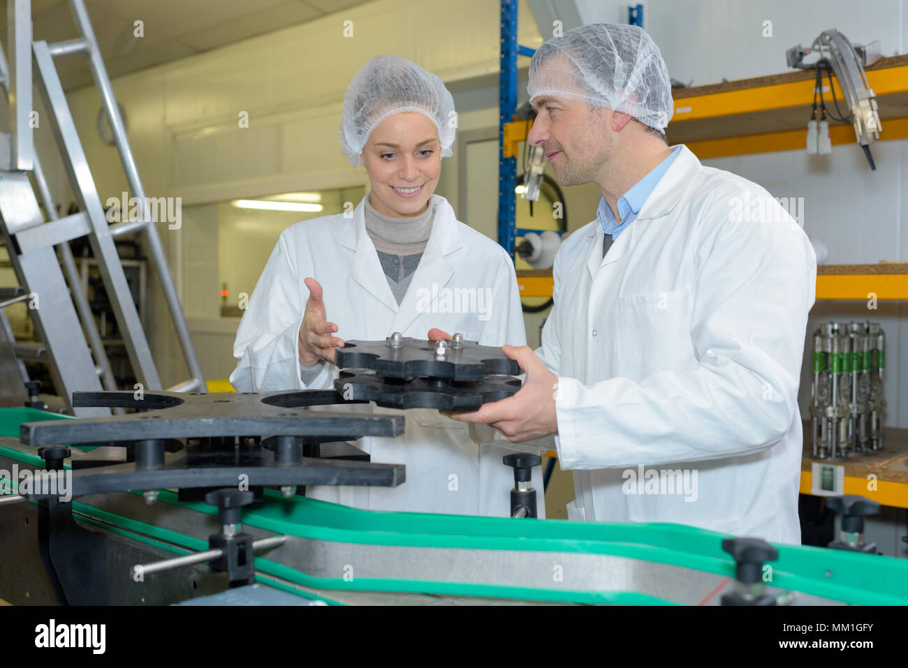 Two happy female factory workers hi-res stock photography and images ...