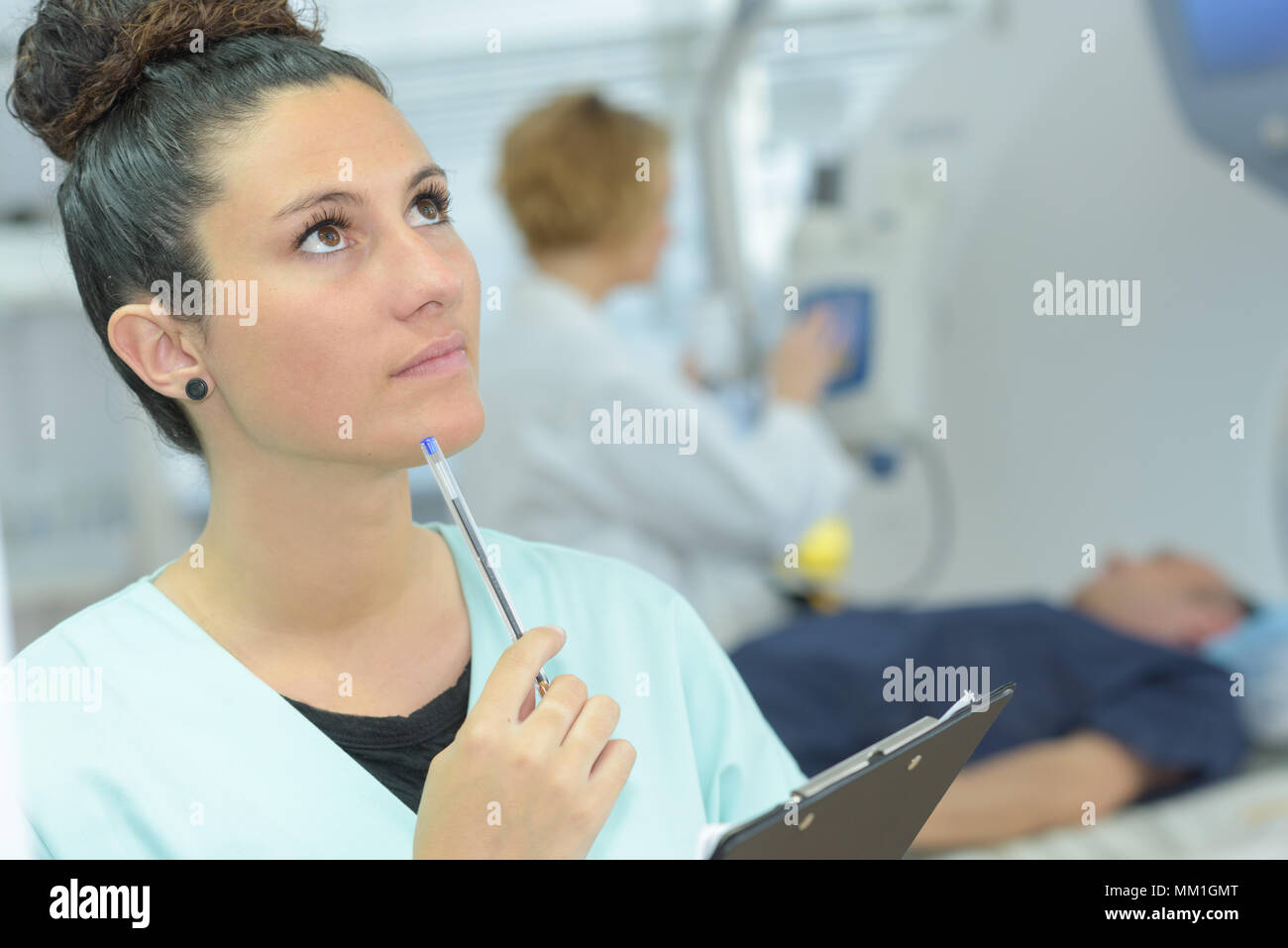 nurse writing a medical record in the hospital hallway Stock Photo - Alamy