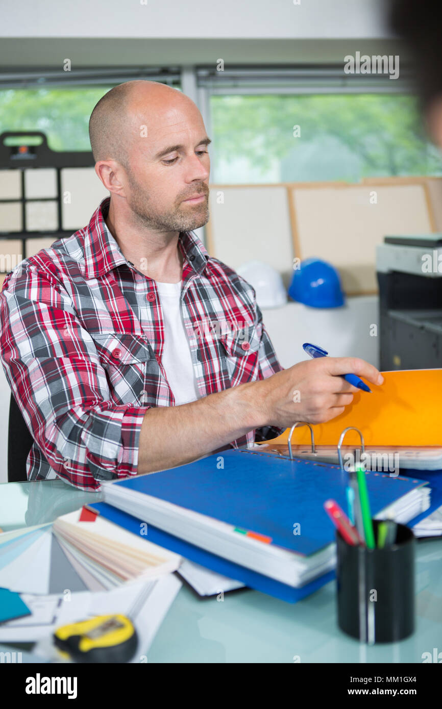 worker doing paperwork in his office Stock Photo - Alamy