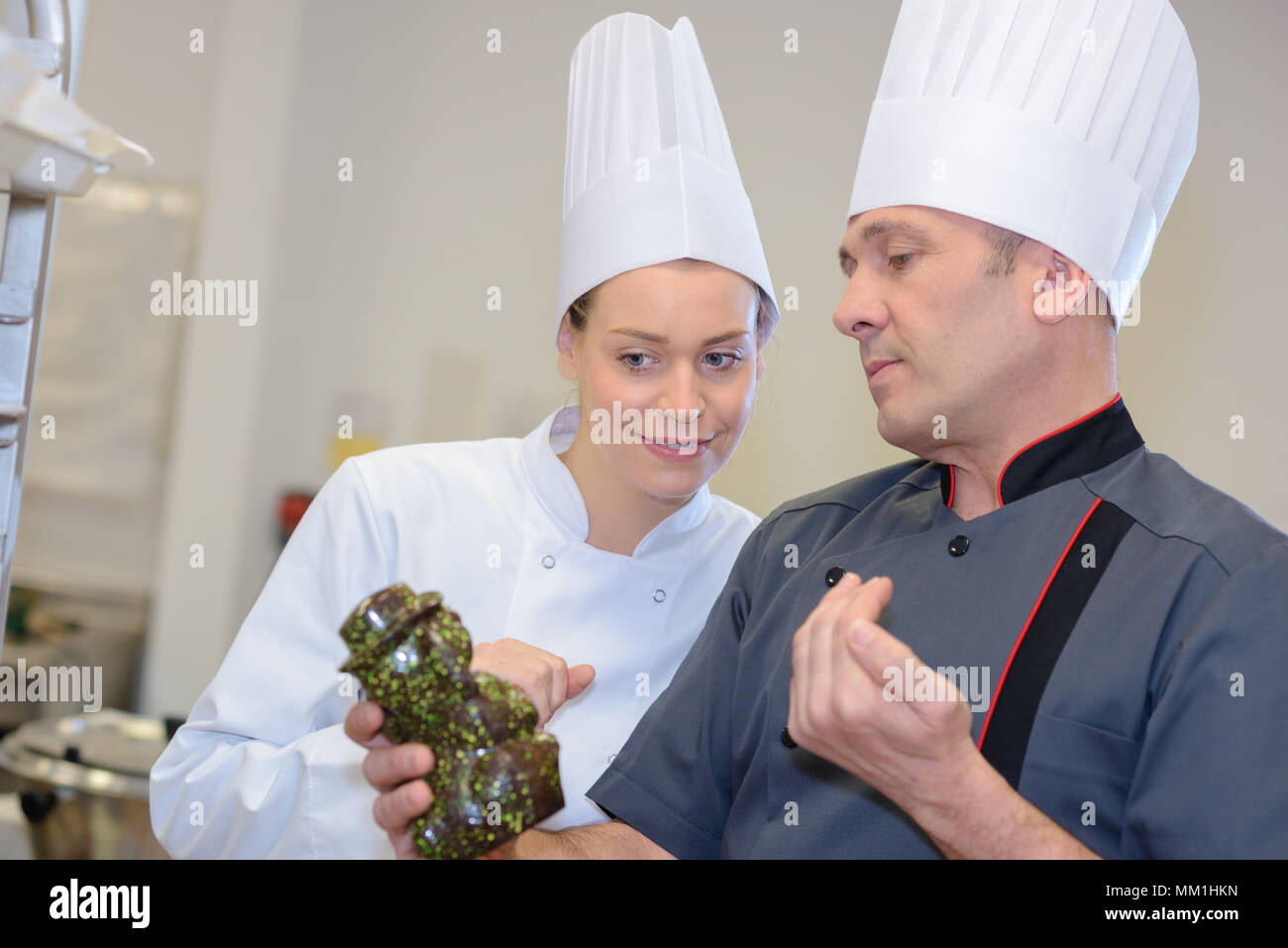 chocolate workers talking Stock Photo - Alamy