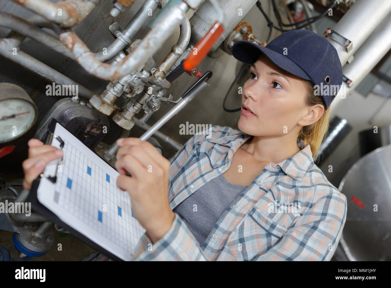 female machine technician doing her inspection Stock Photo - Alamy