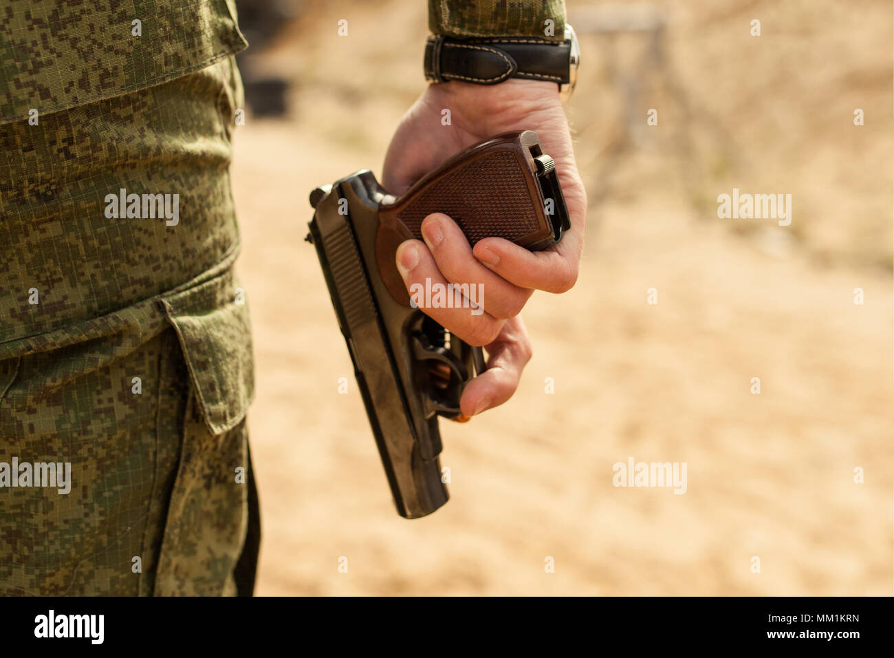 Man's hand holding revolver hi-res stock photography and images - Alamy
