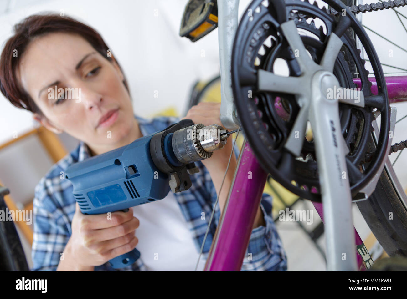Woman electric using screwdriver hi-res stock photography and images ...