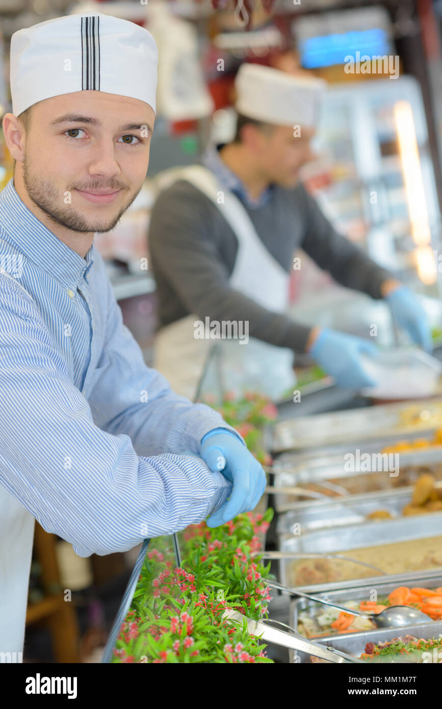 Supermarket deli worker hi-res stock photography and images - Alamy