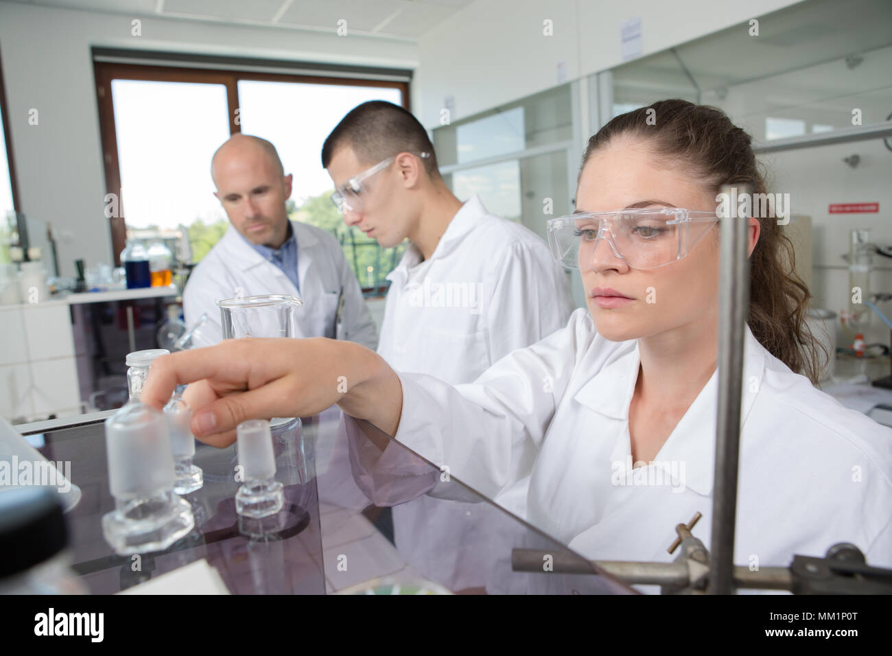 students leading an experiment in the laboratory Stock Photo - Alamy