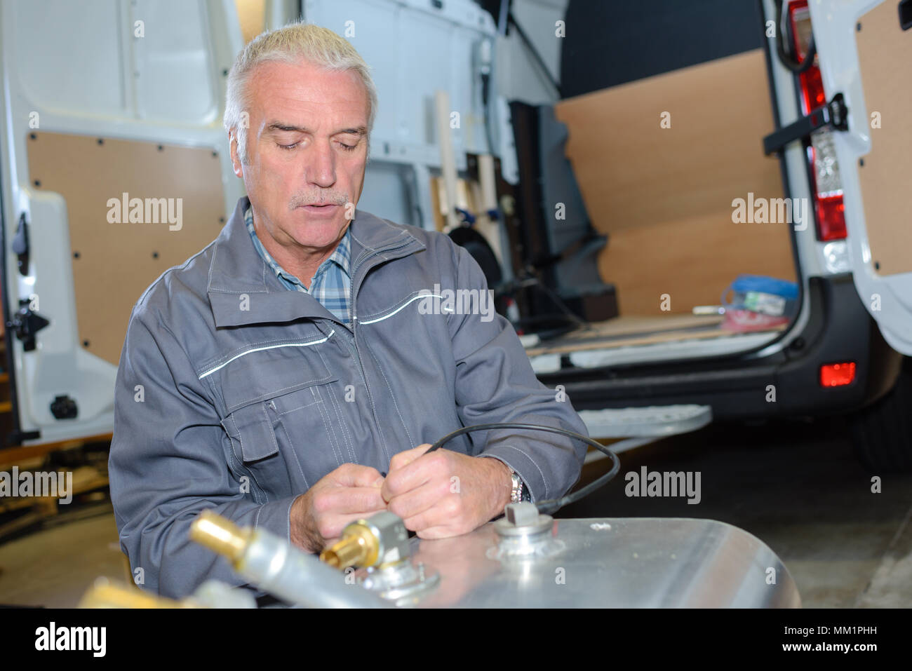 Man connecting cable Stock Photo - Alamy
