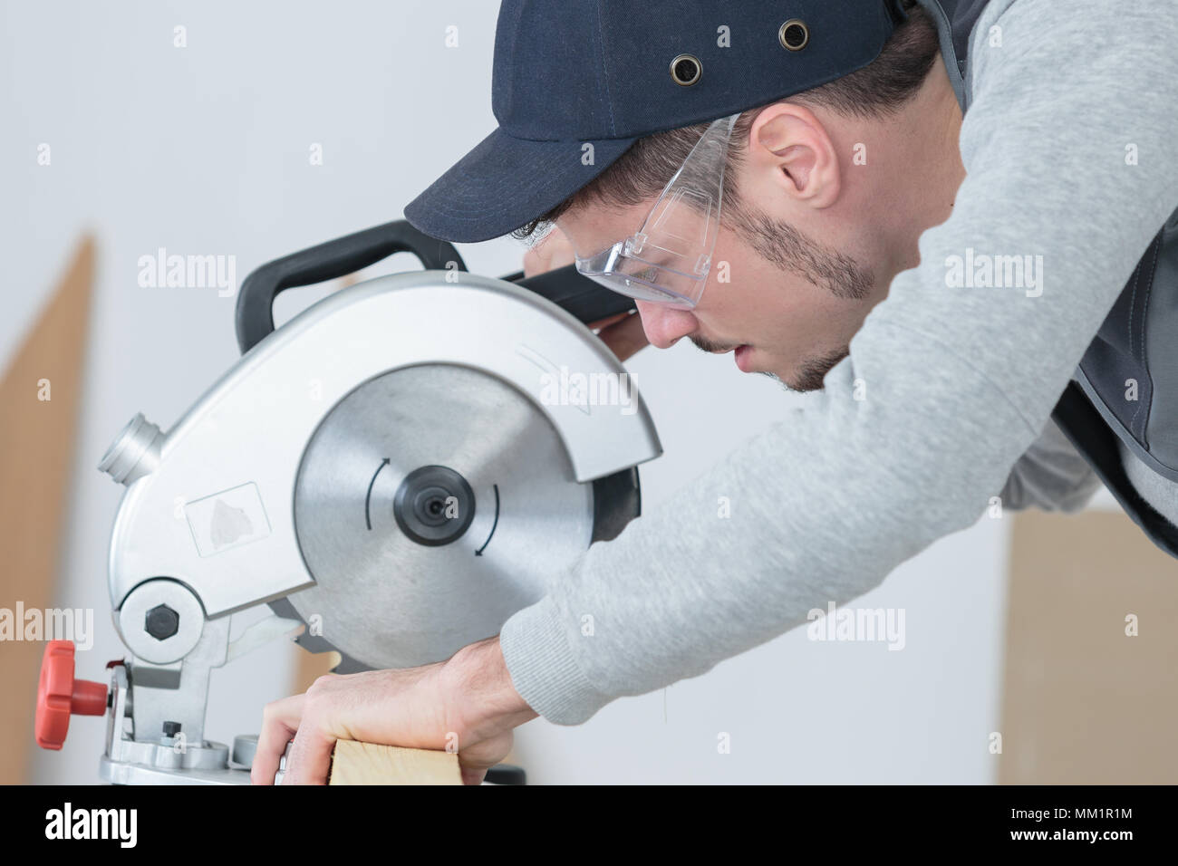 Man using circular saw Stock Photo - Alamy