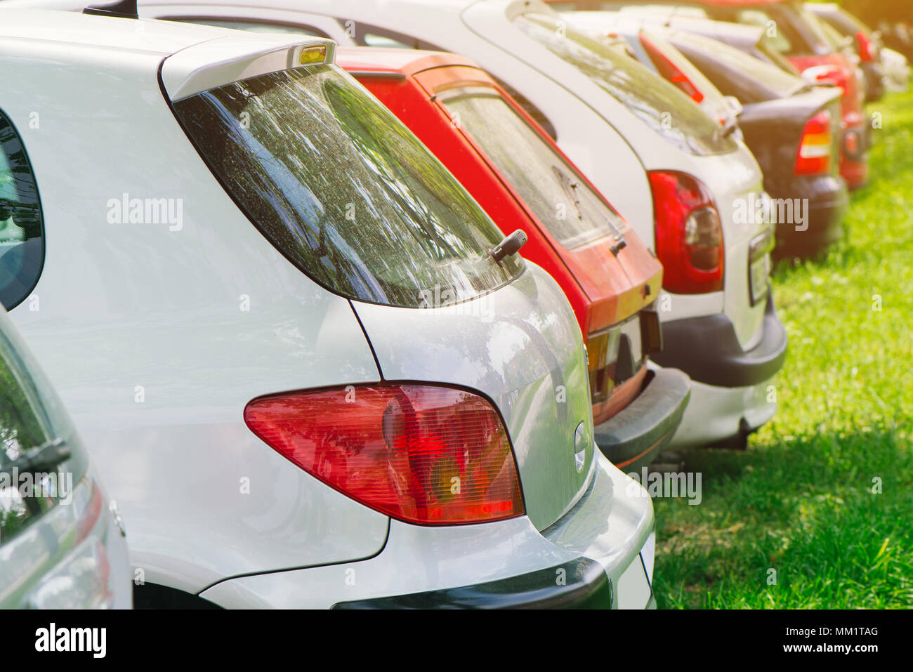 Cars parked on grass hi-res stock photography and images - Alamy