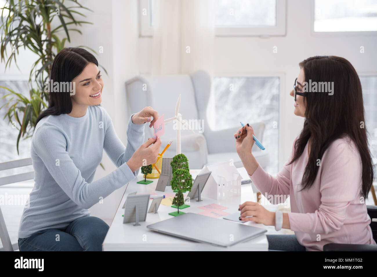 Sharing work environment hi-res stock photography and images - Alamy