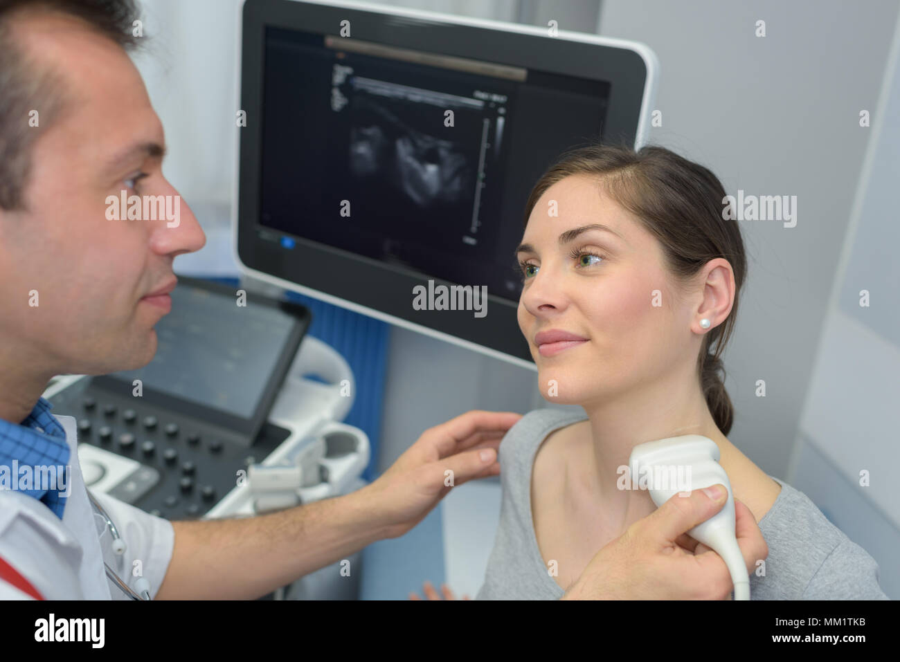 young woman doing neck ultrasound examination at hospital Stock Photo ...