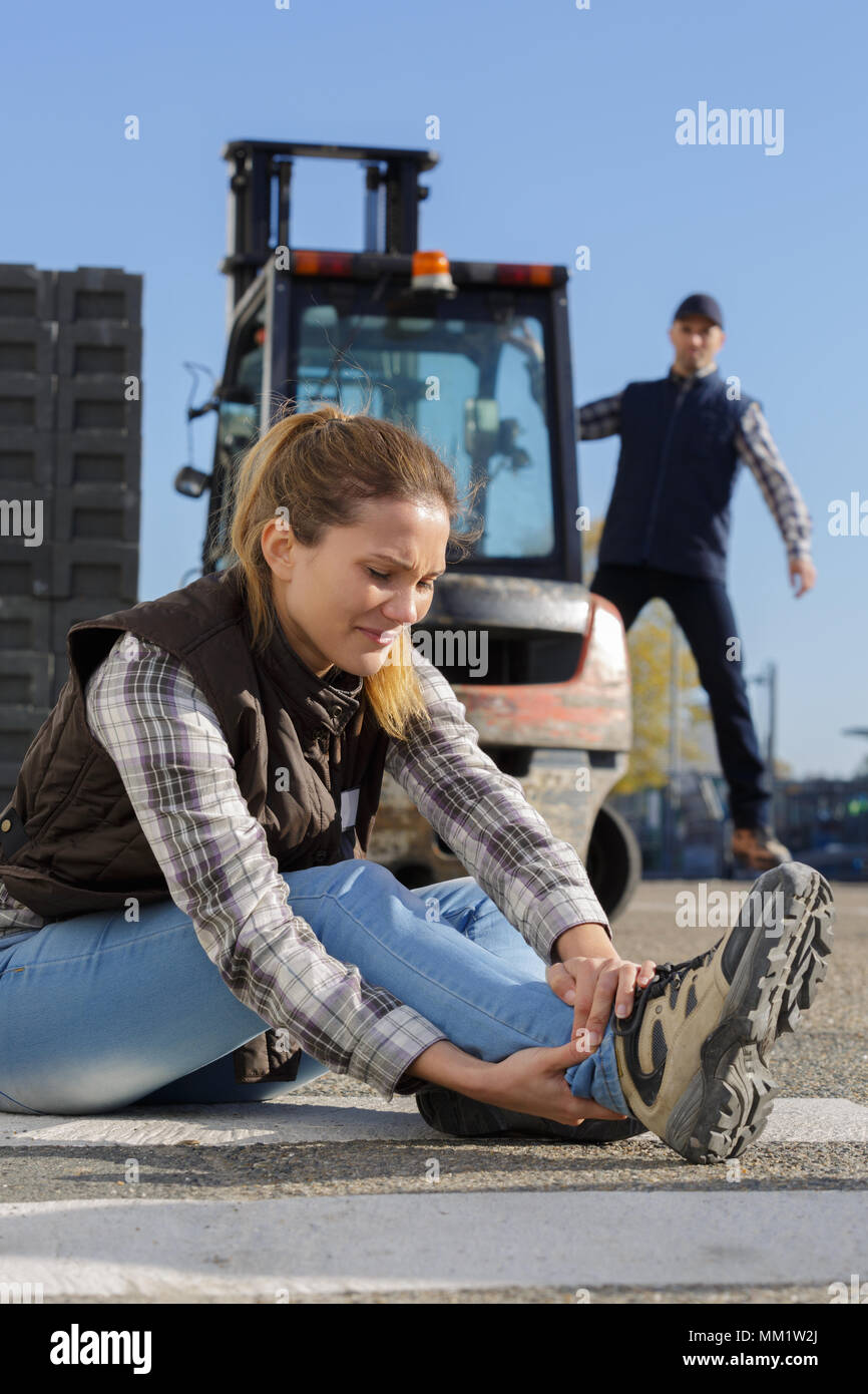 female worker sprained during work Stock Photo - Alamy