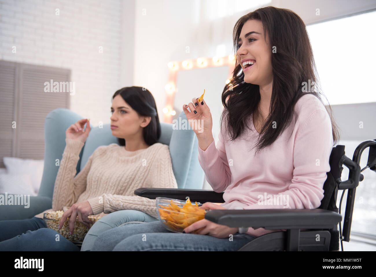 Attractive two sisters spending time together Stock Photo - Alamy