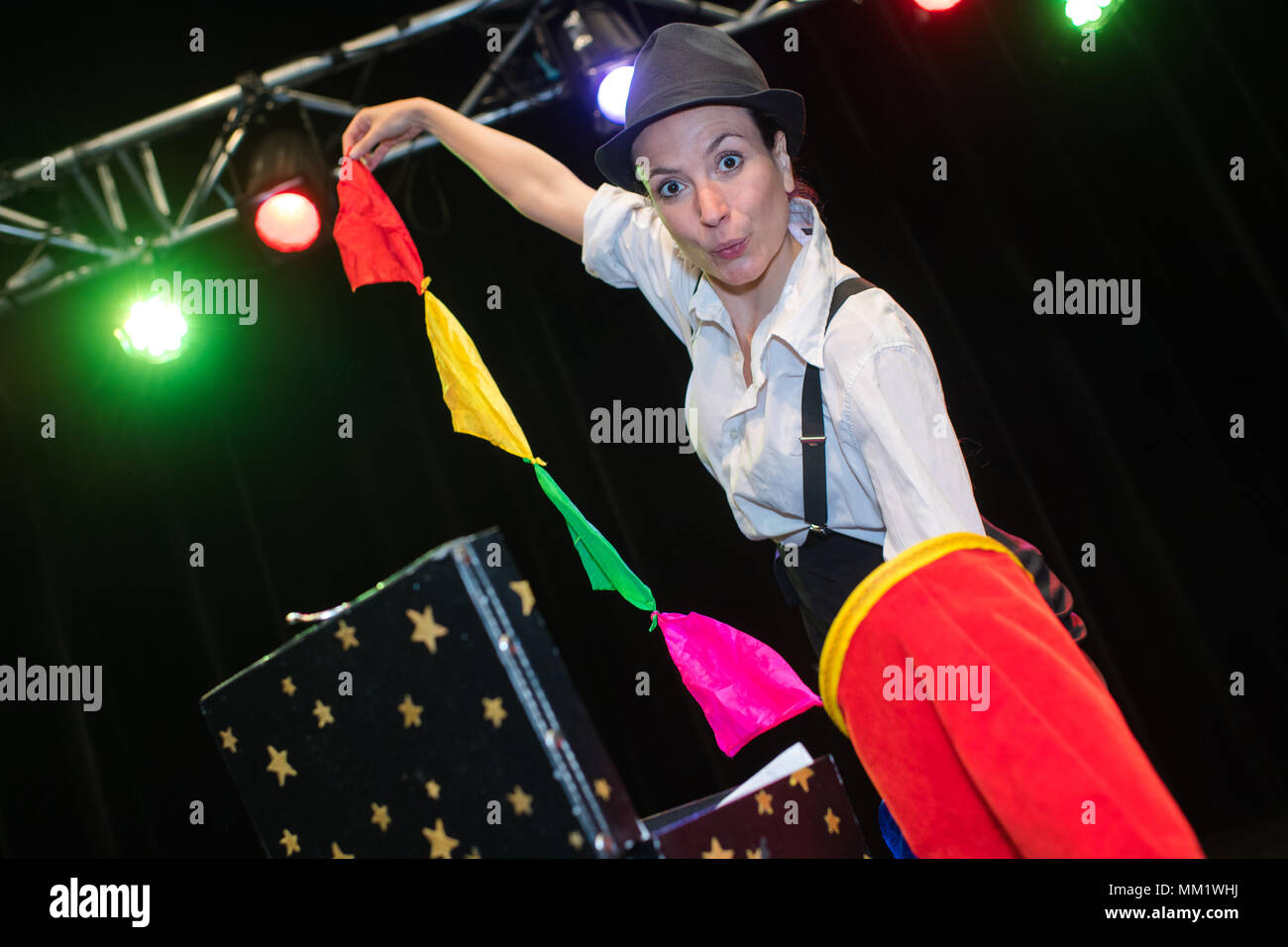 beautiful magician on circus arena stage Stock Photo - Alamy