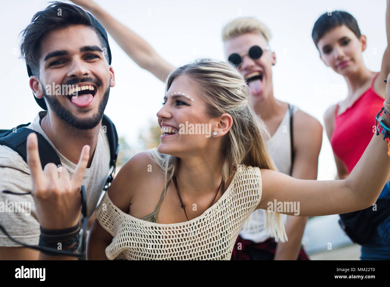 Happy friends having fun at music festival Stock Photo - Alamy