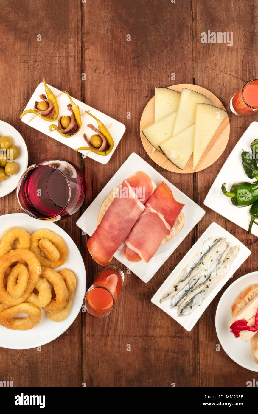 An overhead photo of an assortment of Spanish tapas food, shot from ...