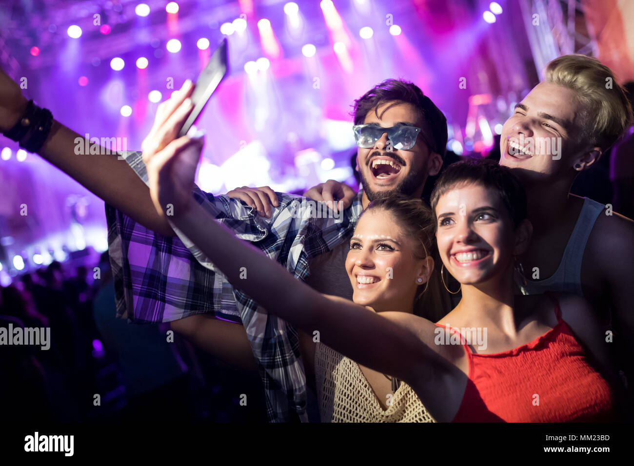 Happy friends having fun at music festival Stock Photo - Alamy