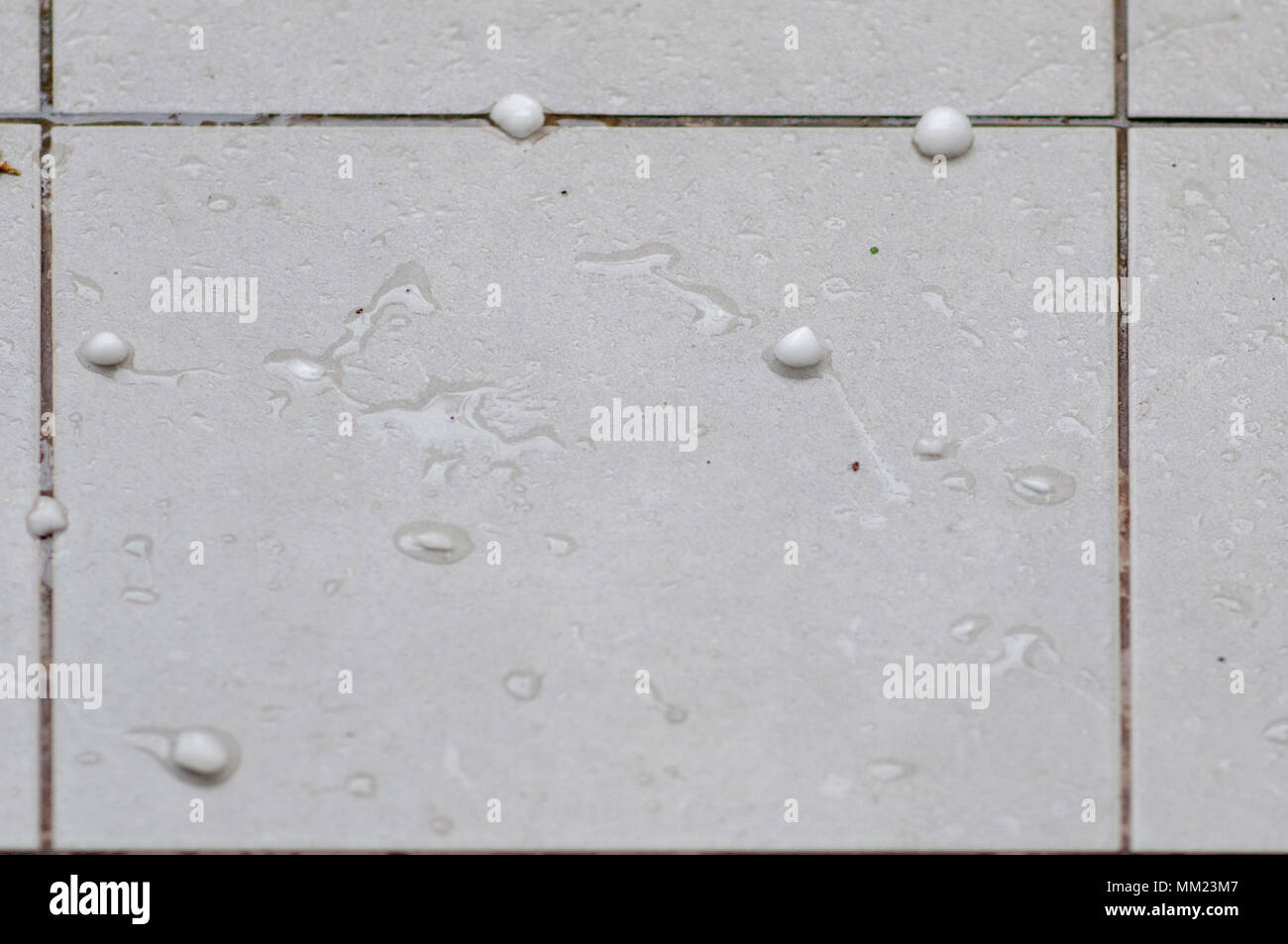 Hail rocks on the porch tiles. Photographed in Tel Aviv, Israel in May ...