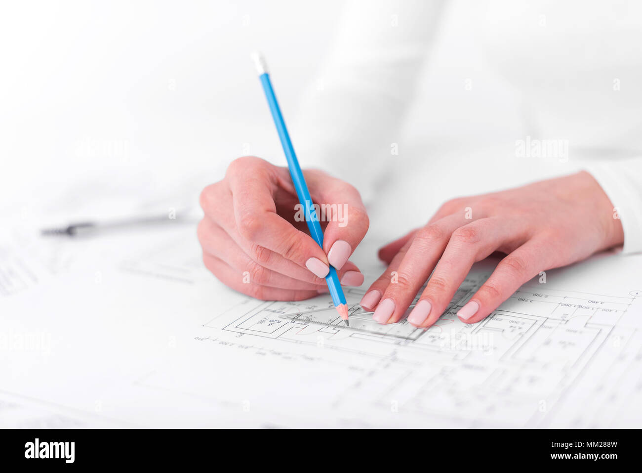 Engineer works with drawings Stock Photo - Alamy