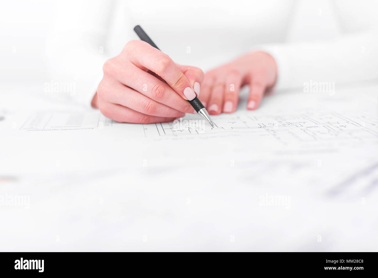 Engineer works with drawings Stock Photo - Alamy
