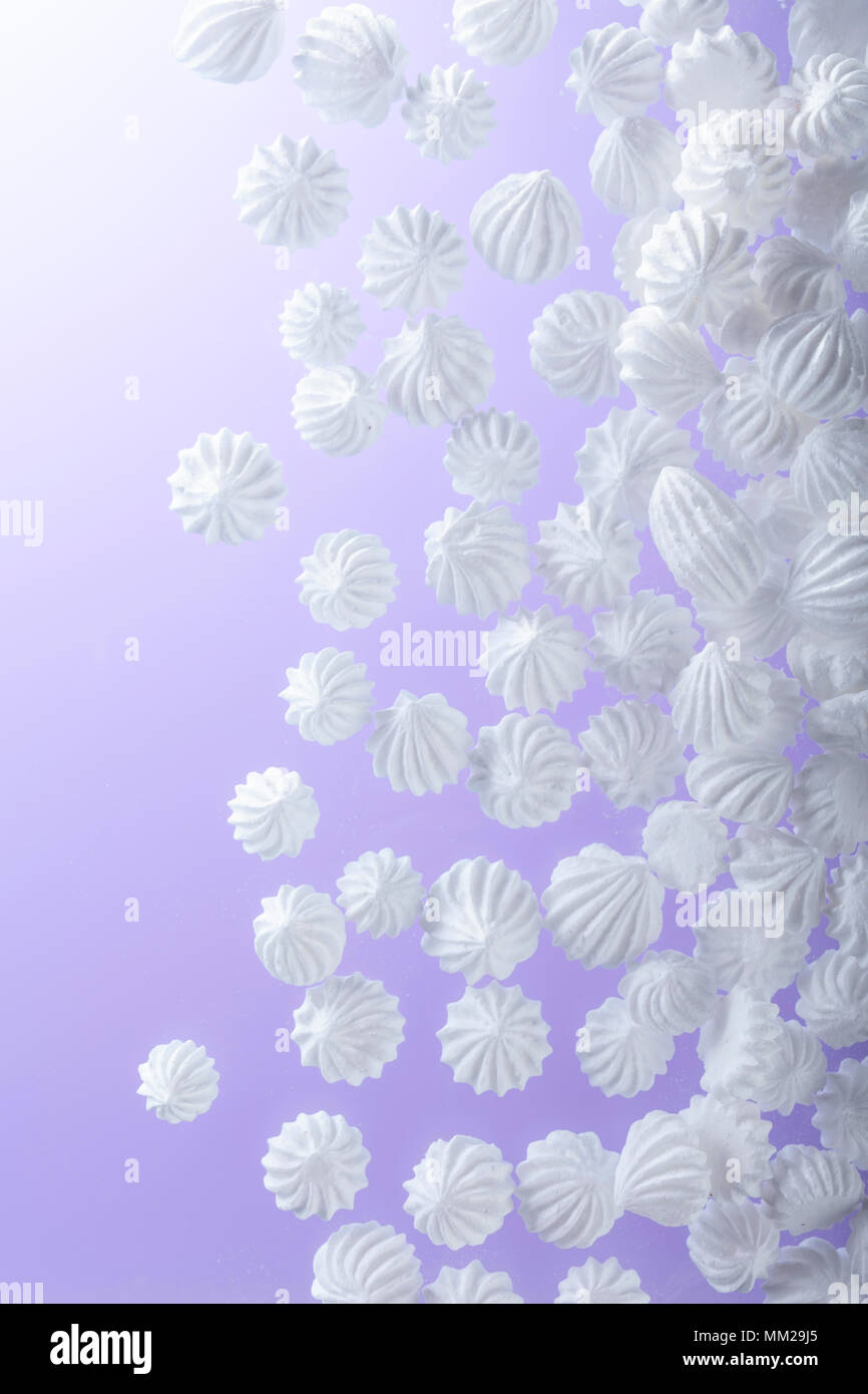 French vanilla meringue cookies on purple background with copy space ...