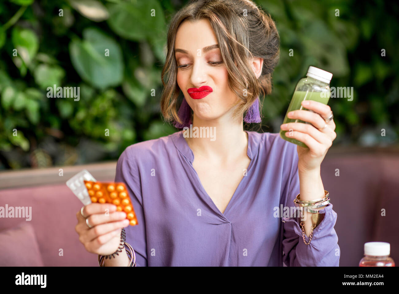 Woman with pills and healthy food Stock Photo - Alamy