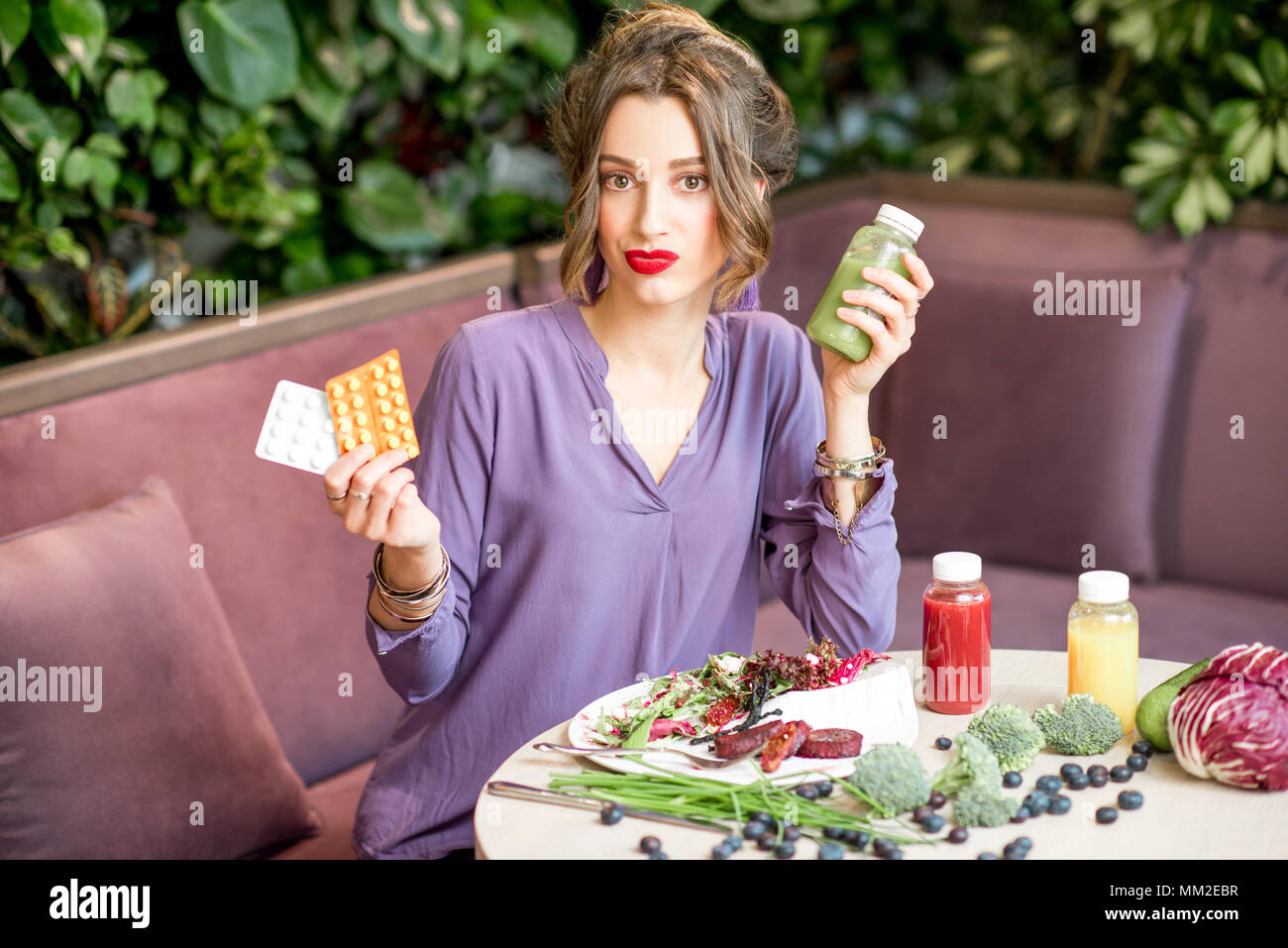 Holding bottles of vitamins hi-res stock photography and images - Alamy