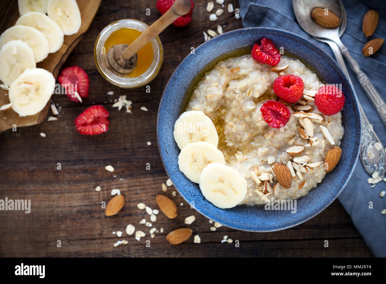 Healthy breakfast - oatmeal with honey, almonds, bananas and raspberry. Overhead view Stock ...