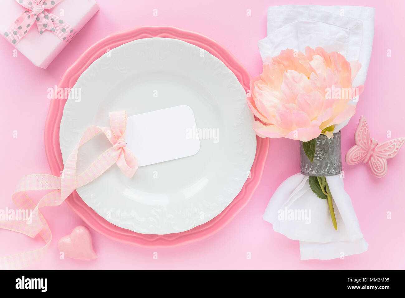 Summer table place setting with white and pastel pink plates white ...