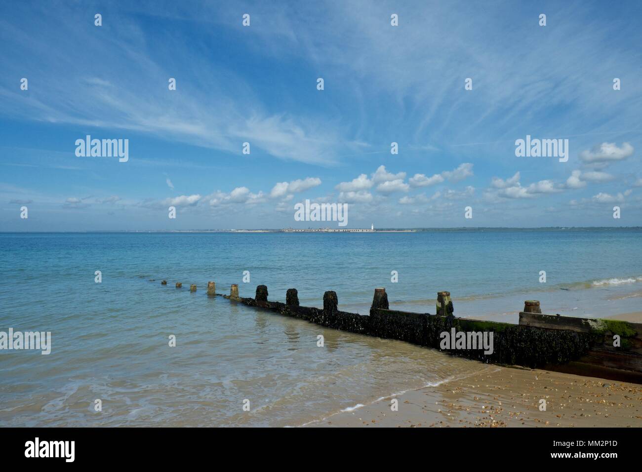 the beach at Colwell Bay, Isle of Wight, UK on a sunny day with light ...