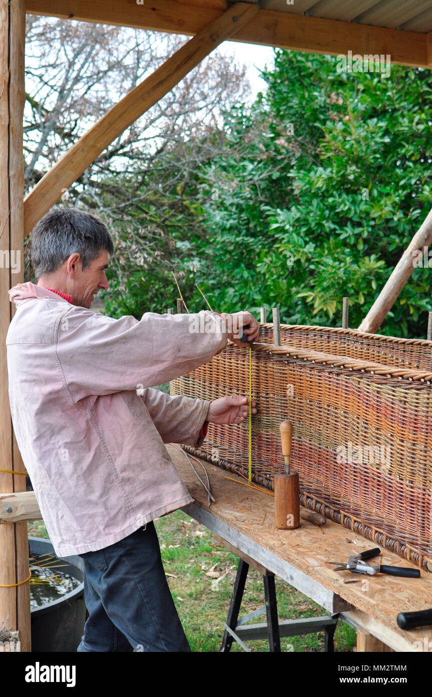 Making off a Wicker coffin for organic funeral Stock Photo - Alamy