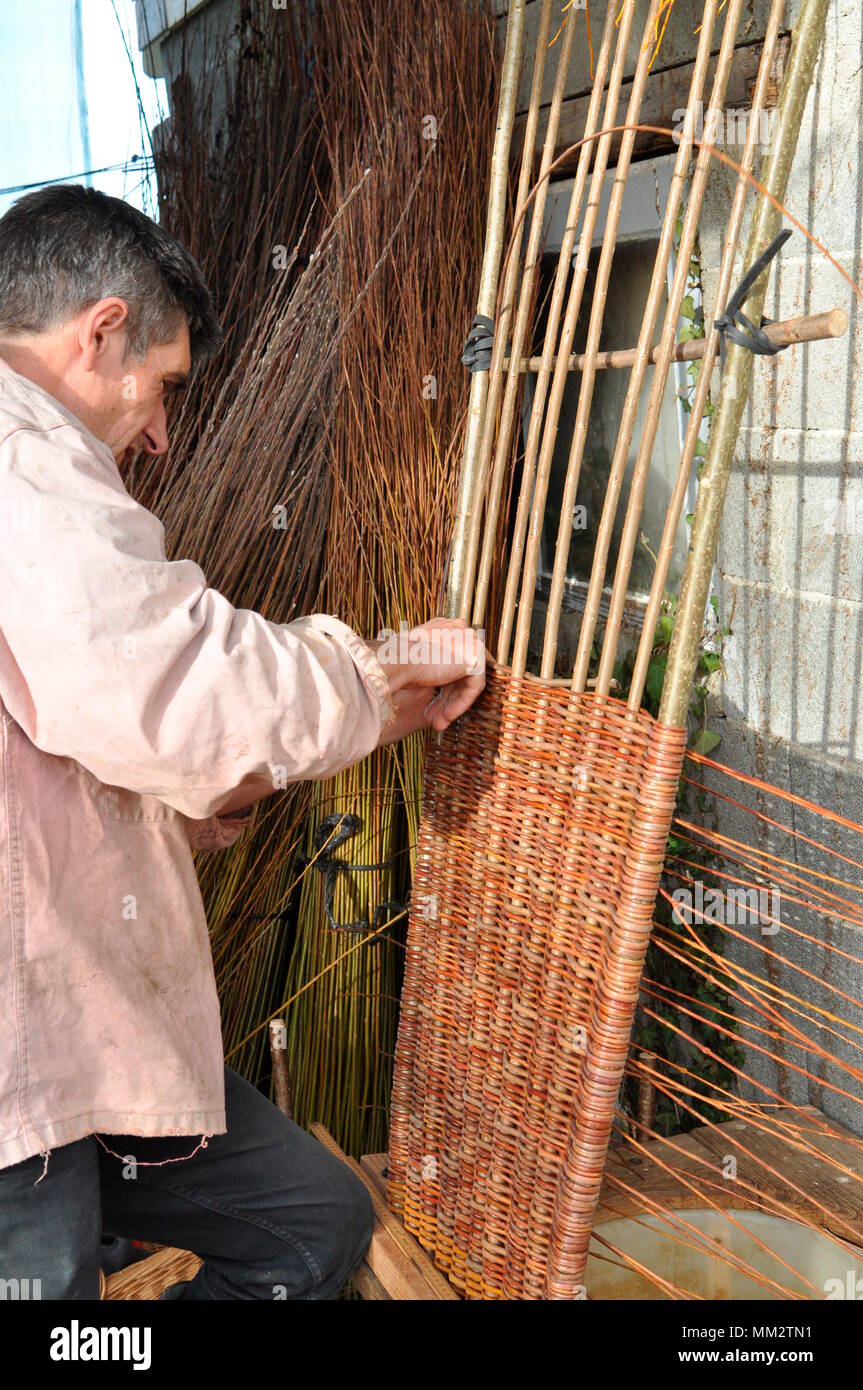 Making off a Wicker coffin for organic funeral Stock Photo - Alamy