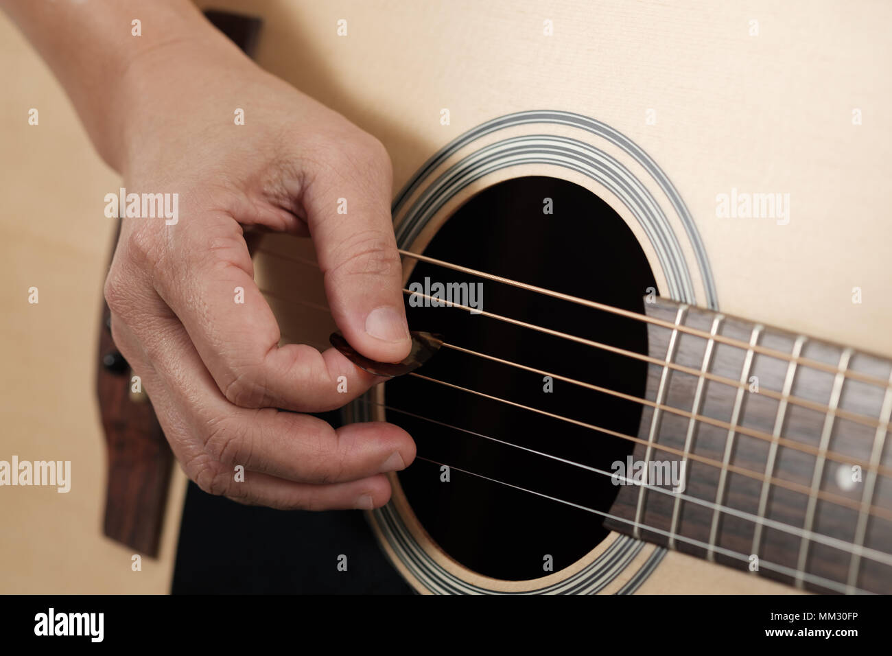 Close up woman's hands playing acoustic guitar Stock Photo - Alamy